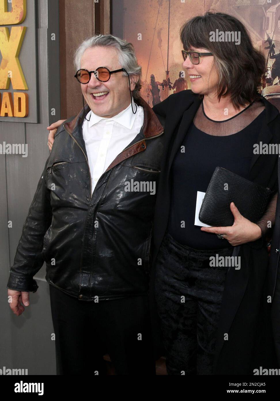 Director/producer George Miller, left, and Margaret Sixel arrive at the ...