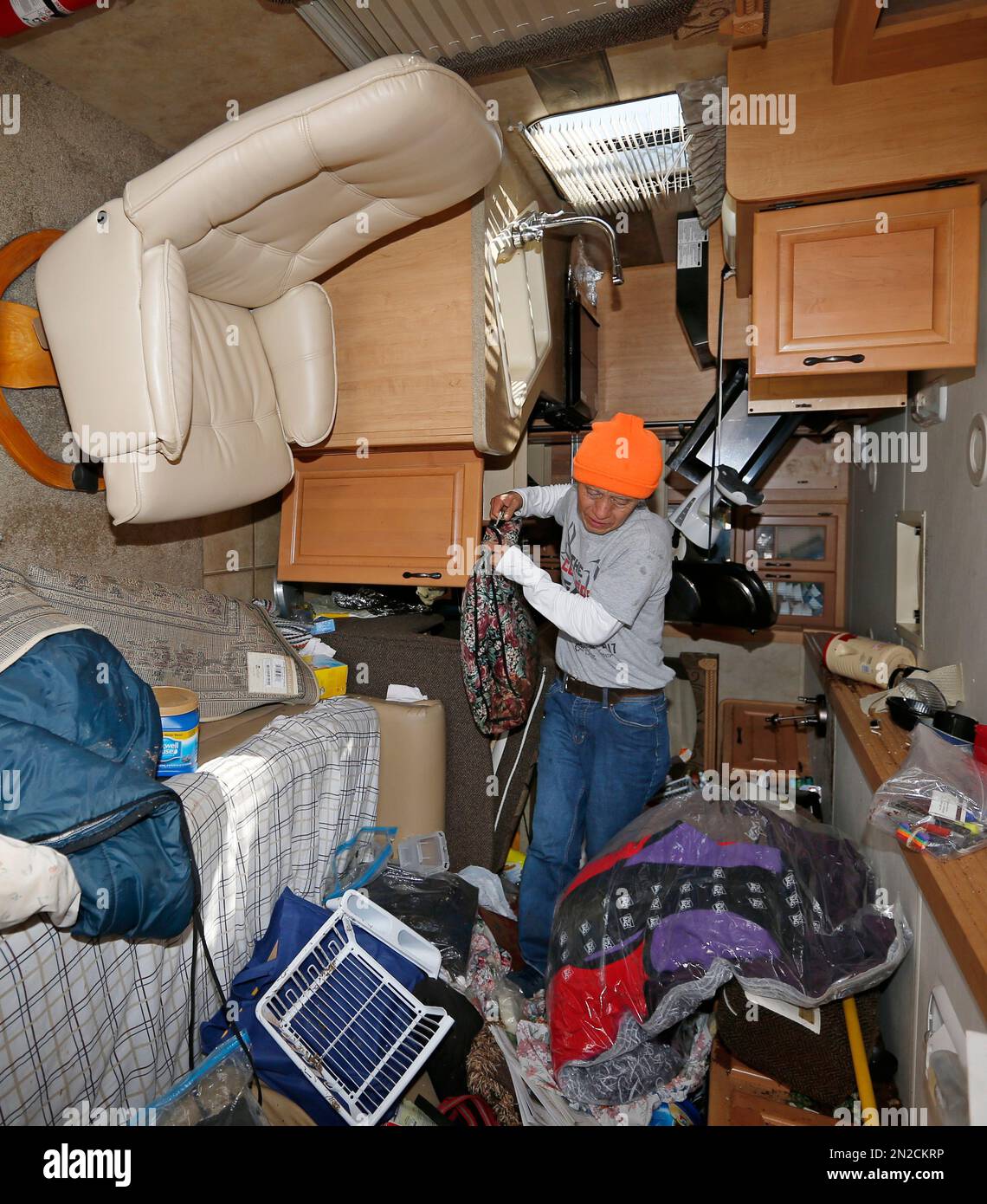 Yuki Fukui makes his way through his recreational vehicle, which is ...