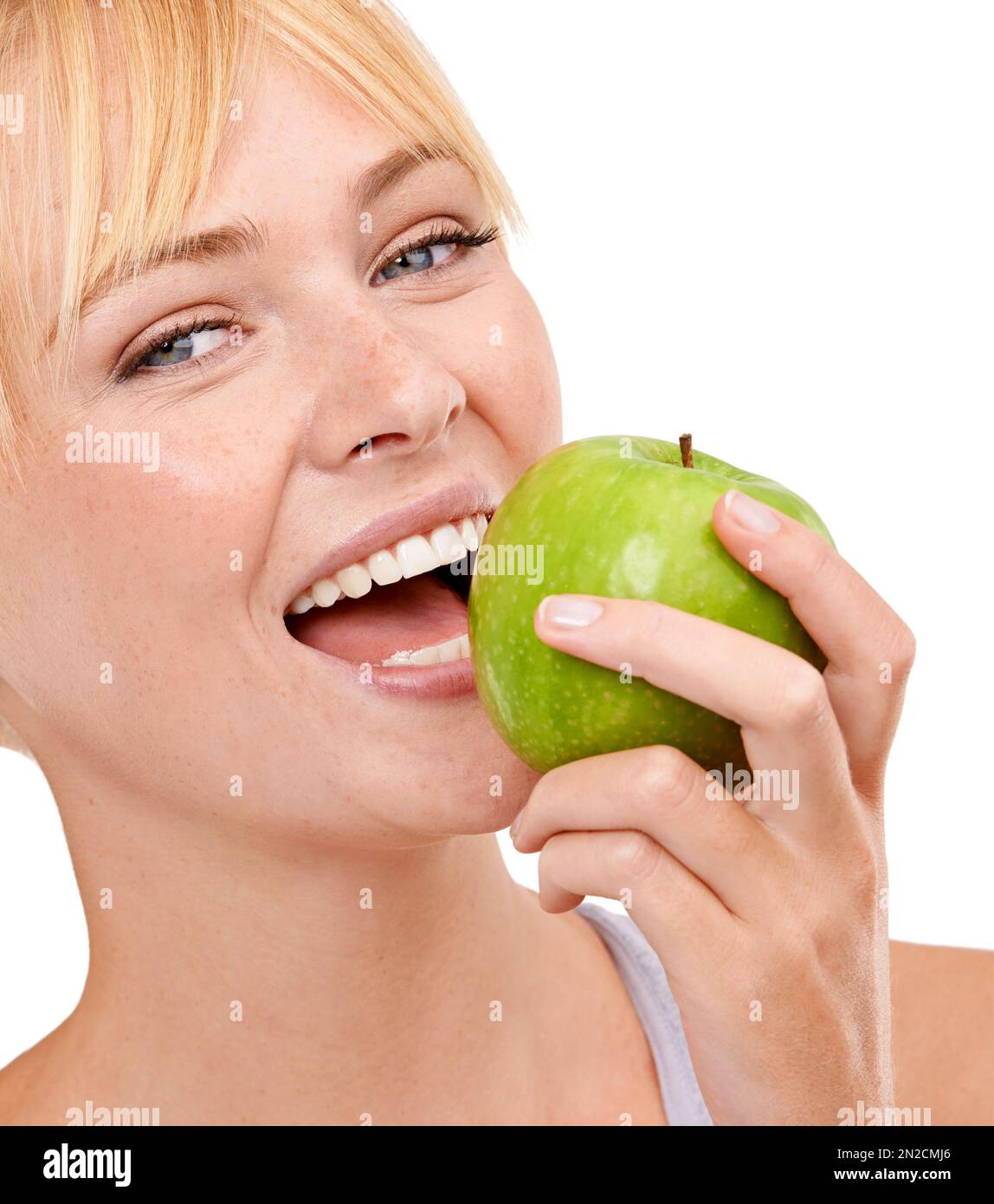You are what you eat. Closeup studio portrait of an attractive young ...