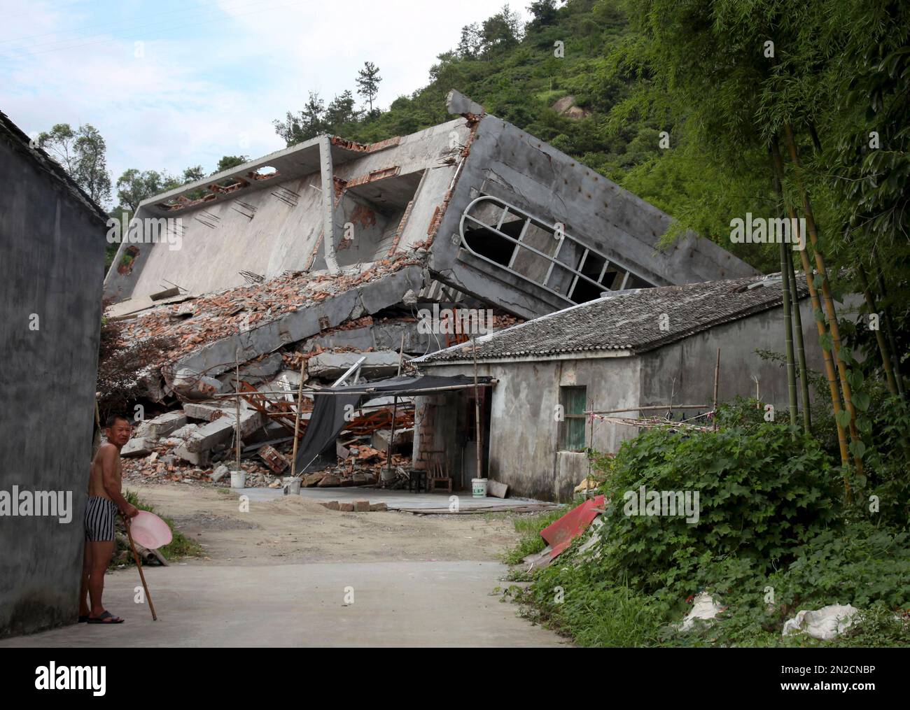 FILE - In this file photo taken July 16, 2014, a man stands near the ...