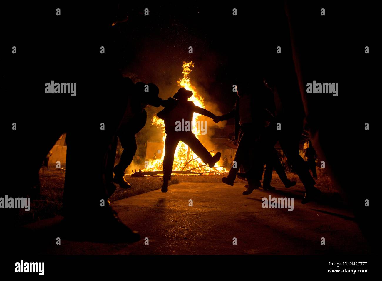 Ultra-Orthodox Jewish men dance around a bonfire in Jerusalem ...