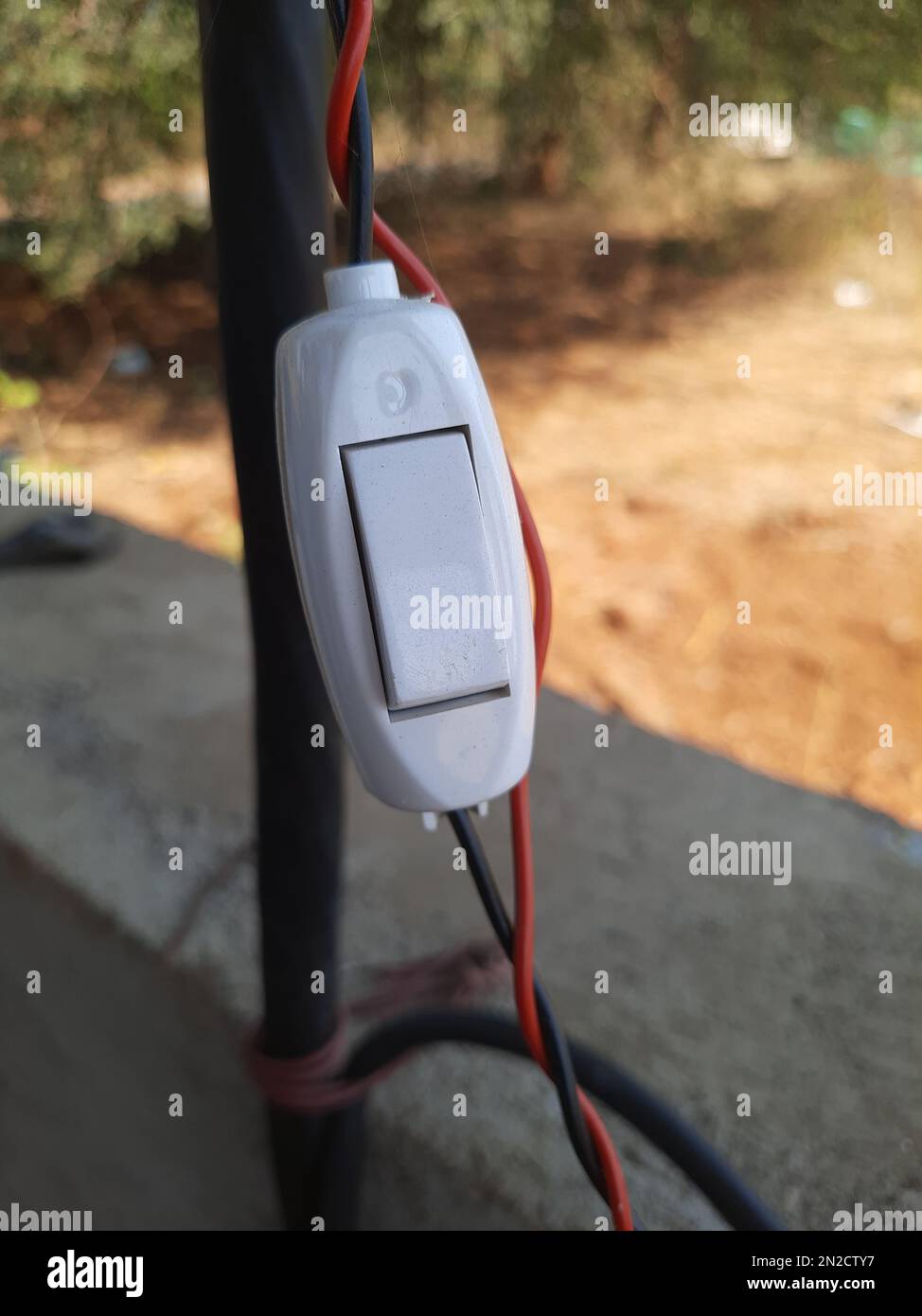 An electric switch button for single phase electric supply on an ...