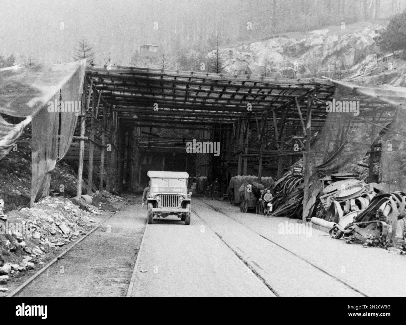 The entrance to the tunnel showing a American First Army jeep coming ...