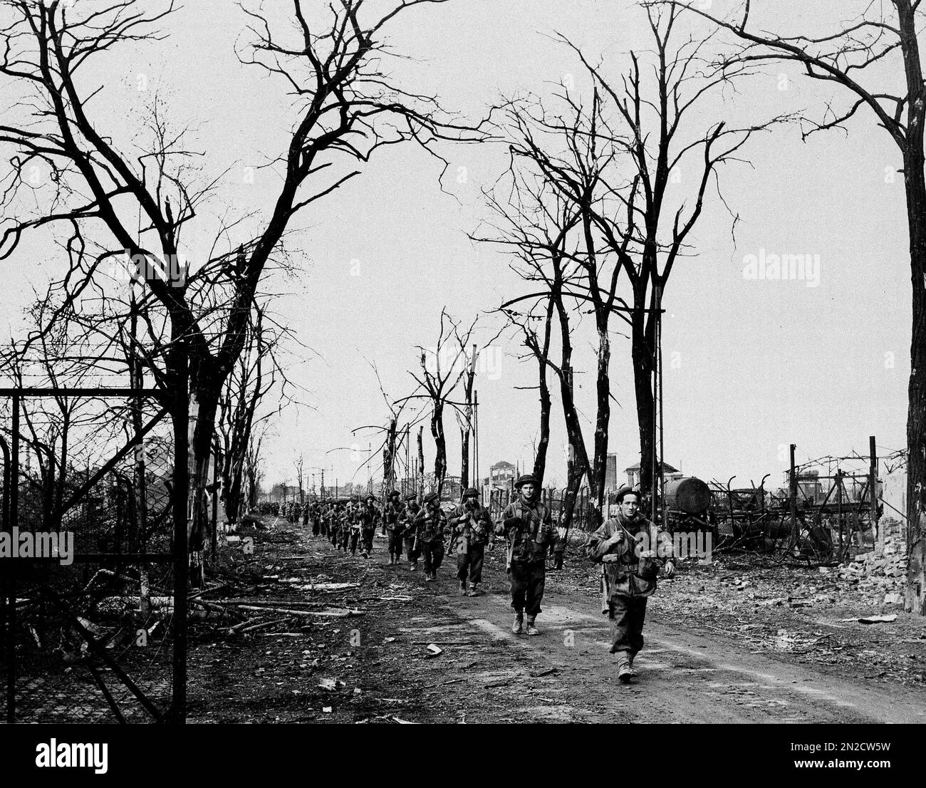 French Canadian troops move up to battle in extended order through a ...