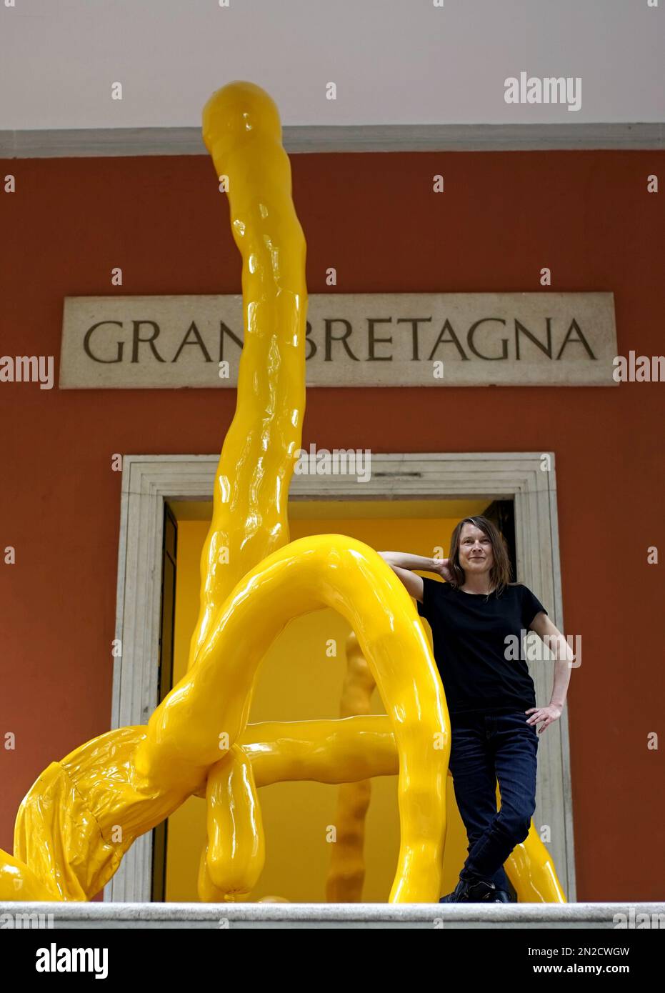 British artist Sarah Lucas poses next to her sculpture 'Gold Cup ...
