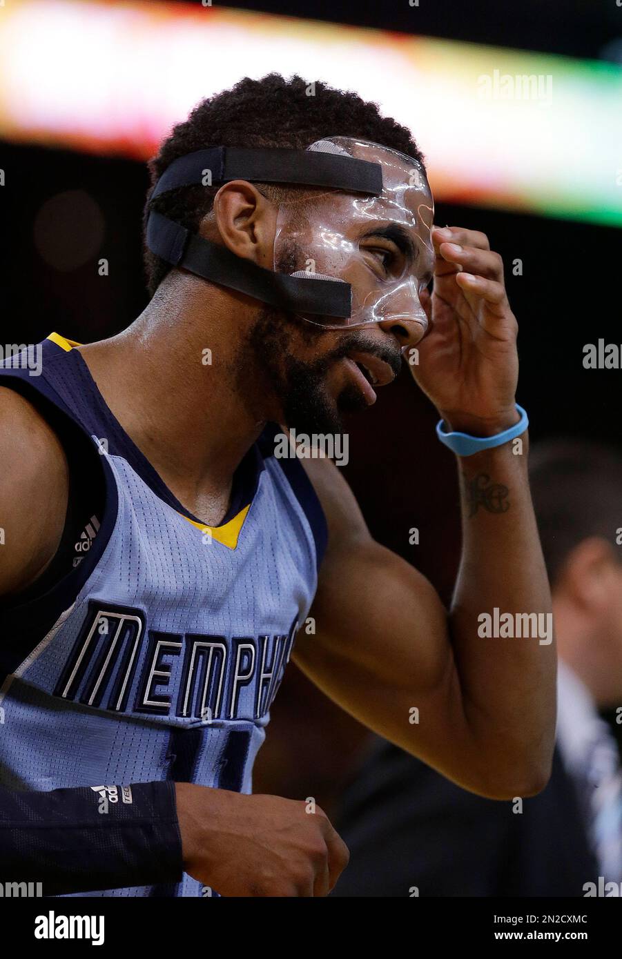 Memphis Grizzlies guard Mike Conley (11) adjusts his mask during the ...