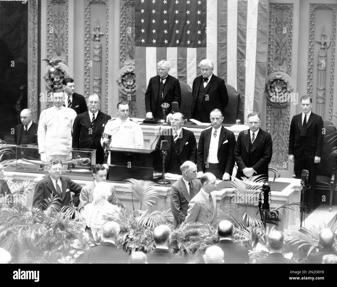 President Franklin D. Roosevelt stands between his aides, Col. Edwin M ...