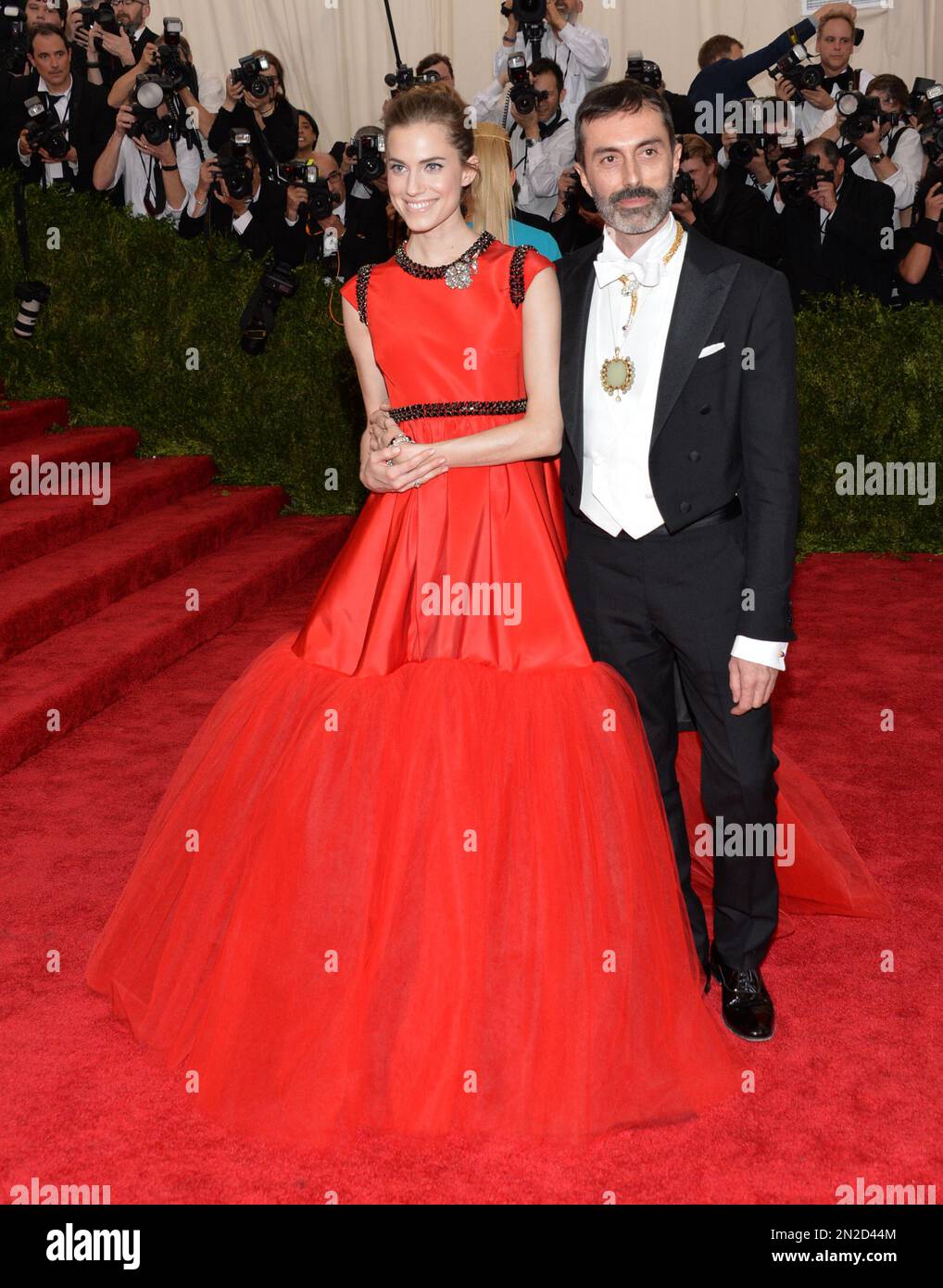 Allison Williams, left, and designer Giambattista Valli arrive at The ...