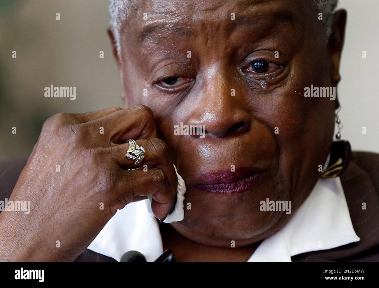 Brenda Stewart wipes away tears Monday, May 4, 2015, in Clayton, Mo ...