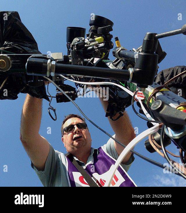 AP staff photographer David J. Phillip, based in Houston, sets up a ...
