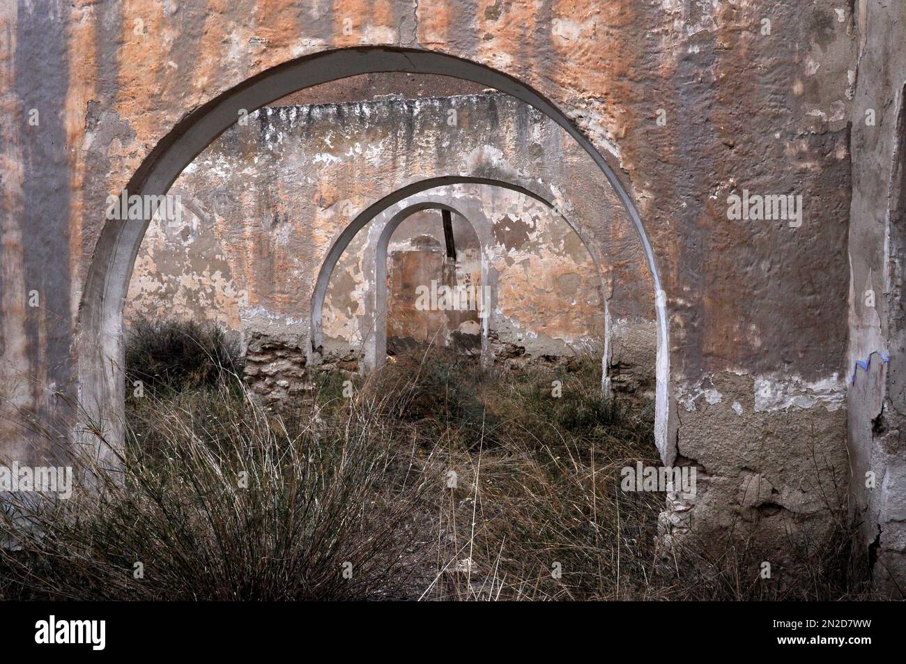 Abandoned house with round arches Stock Photo - Alamy