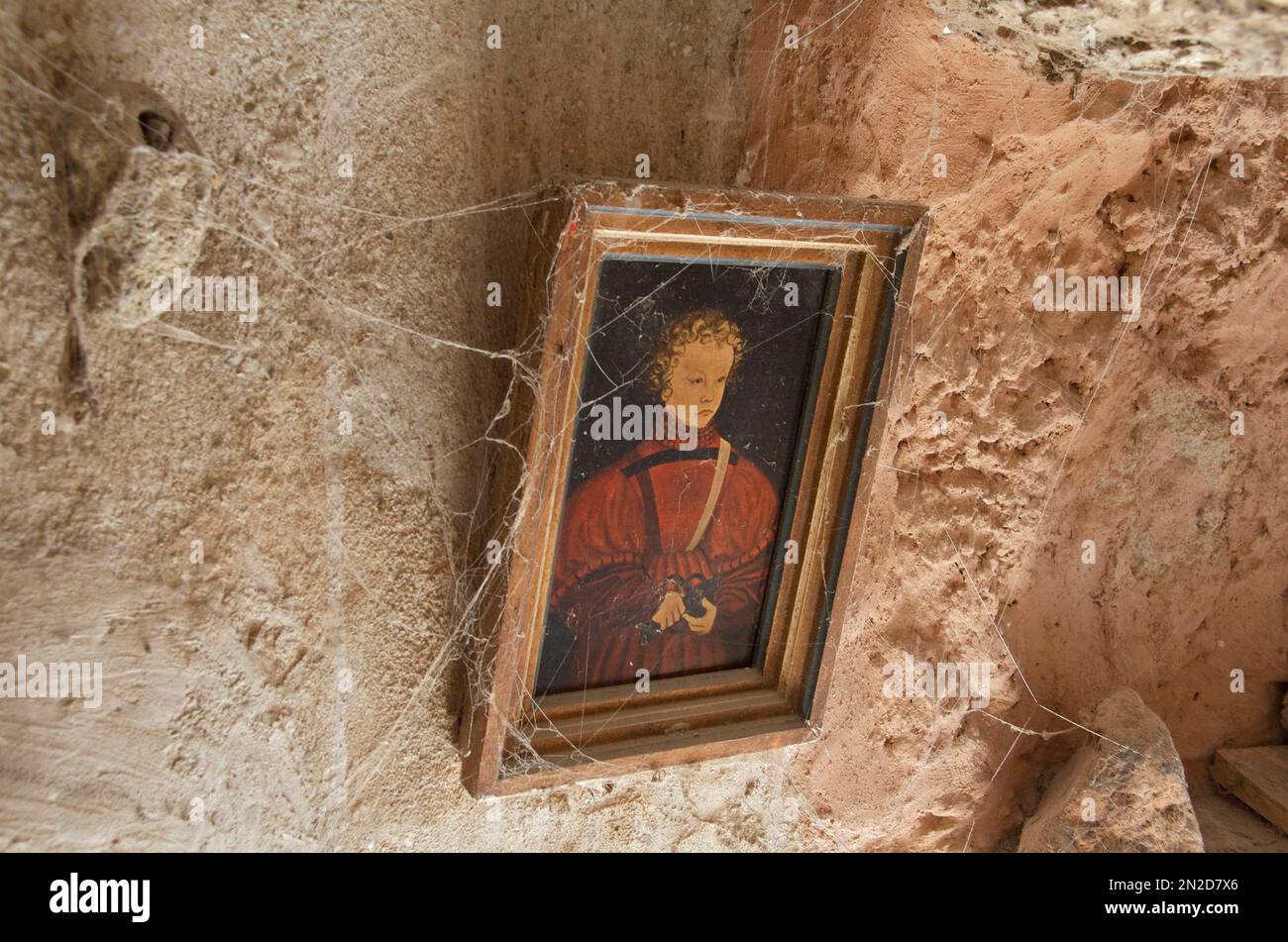 Golden picture frame with cobwebs on clay wall, Bornos, Cabo de Gata ...