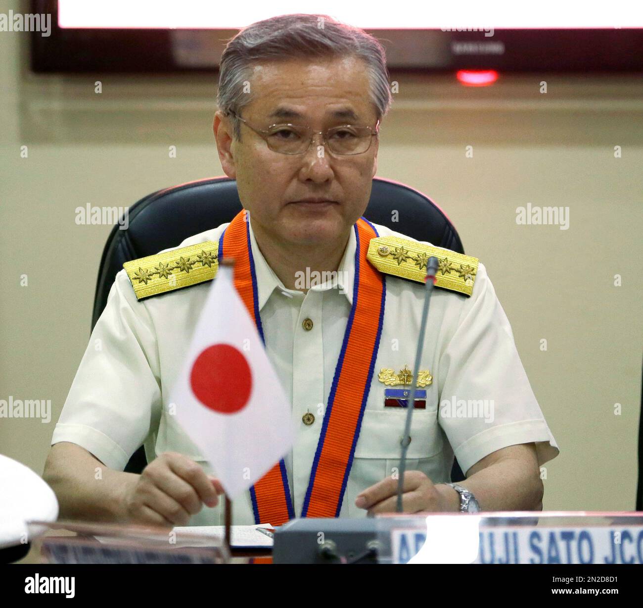 Japan Coast Guard Commandant Adm. Yuji Sato prepares for a meeting with ...