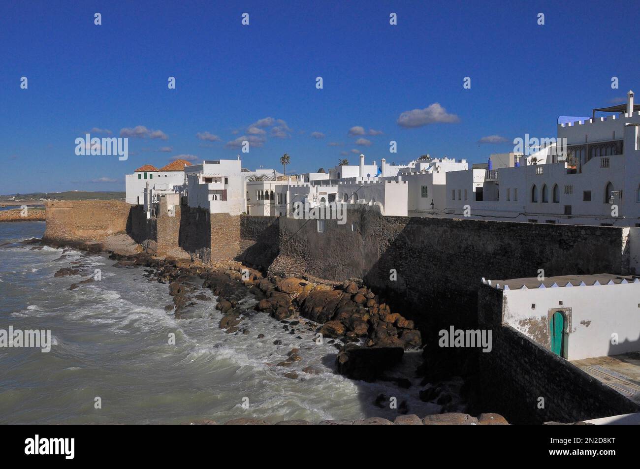 Promenade with fortification wall by the sea, Asilah, Northern Morocco ...