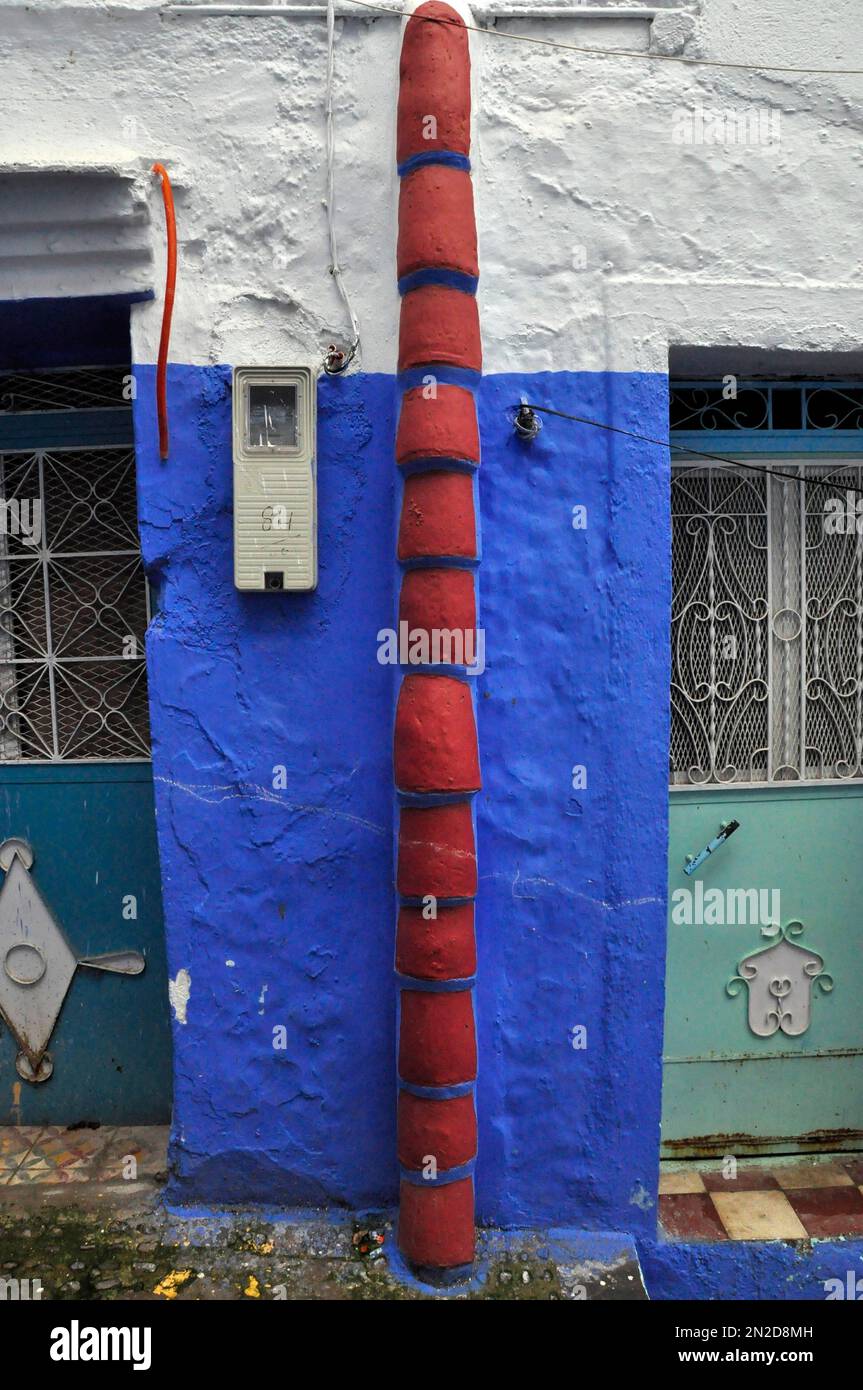 Rain gutter made of roof tiles on house wall, Chefchaouen, Northern ...