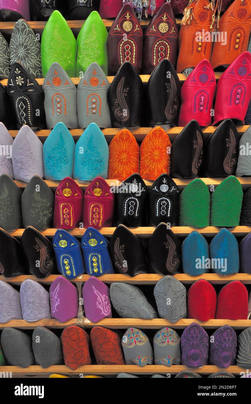 Shelf with colourful traditional Babouche leather shoes of the Berbers ...
