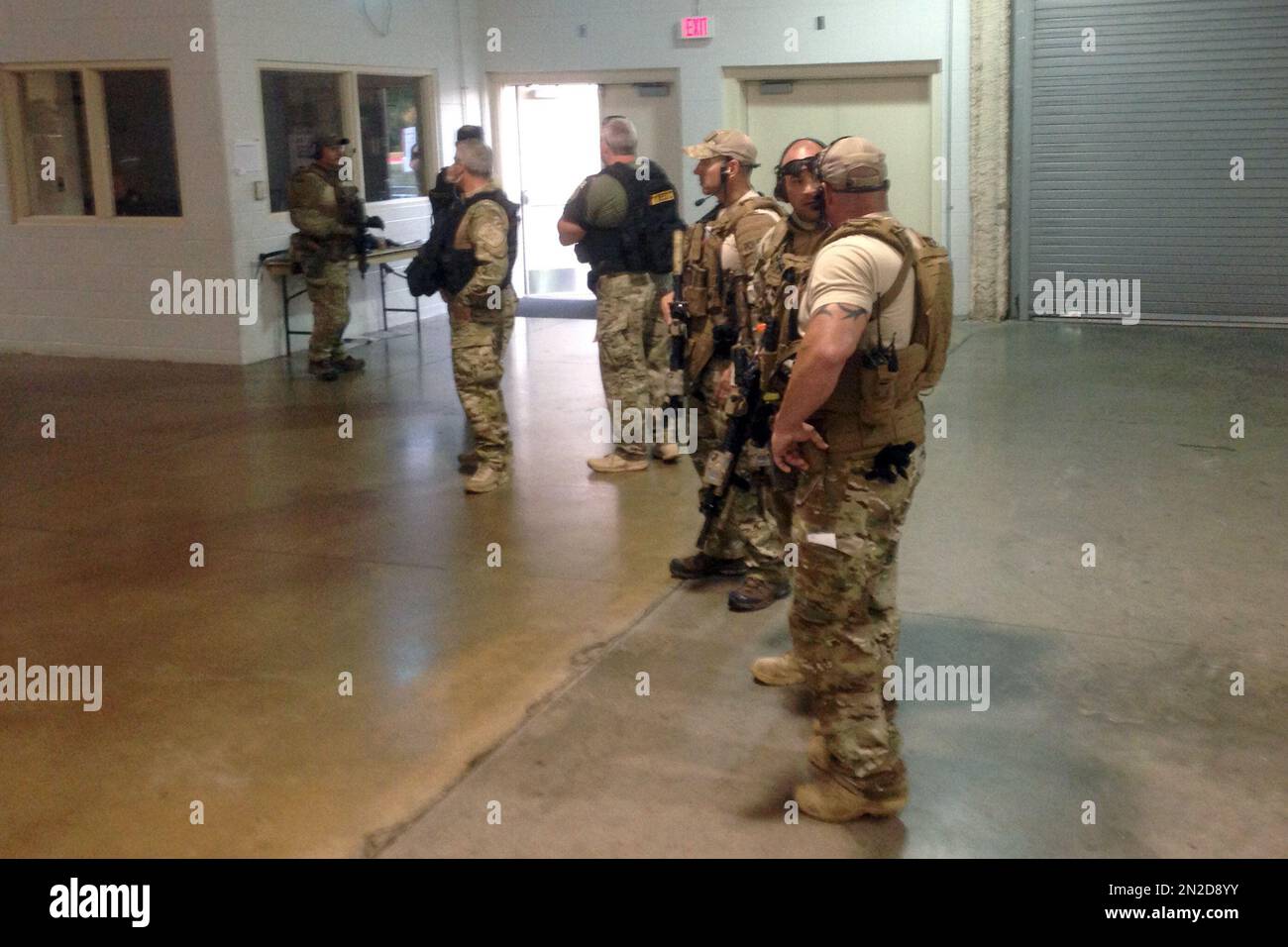 Members of the Garland Police Department are stand inside the Curtis ...