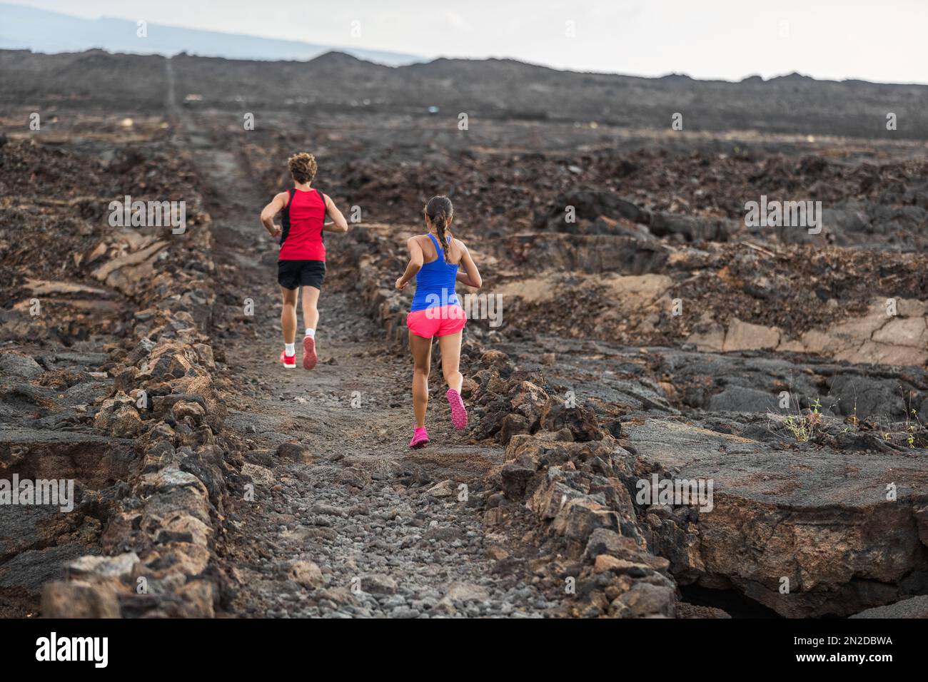 Trail run runners couple fit athletes training together running in ...