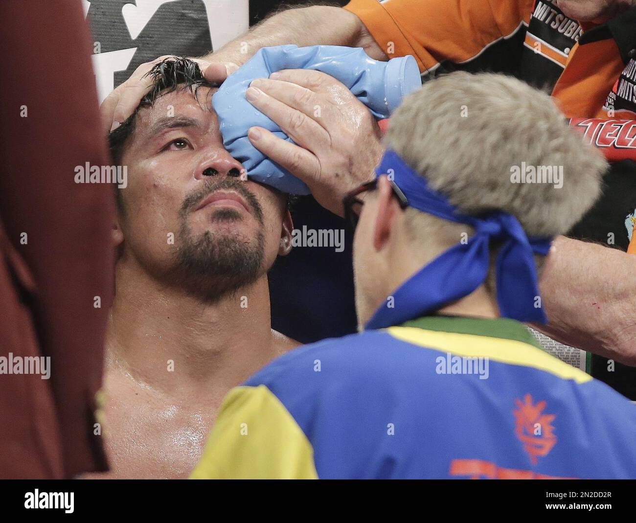 Manny Pacquiao, from the Philippines, is helped in his corner between ...
