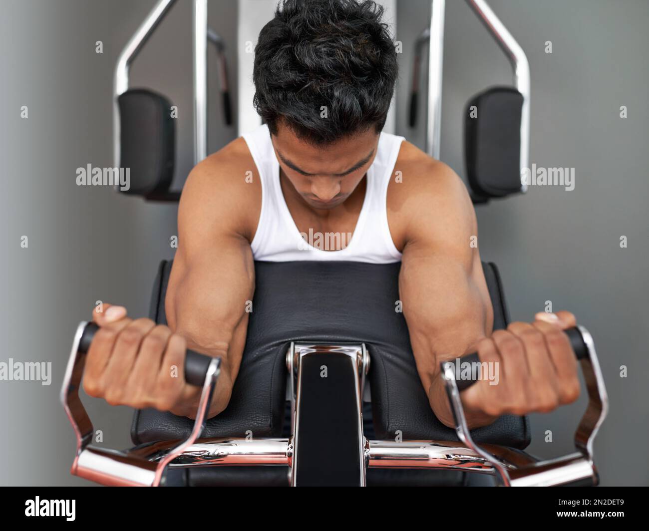 Keeping my head down and strength up. Low-angle view of a young ethnic ...