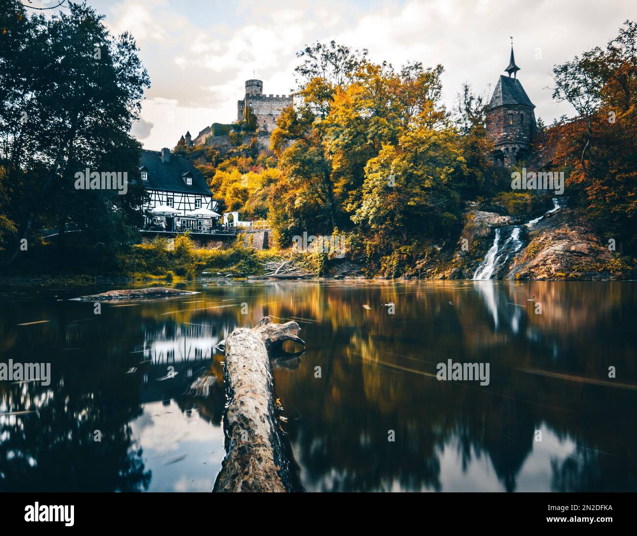 Pyrmonter mill at the waterfall of Elzbach with the castle Pyrmont in ...