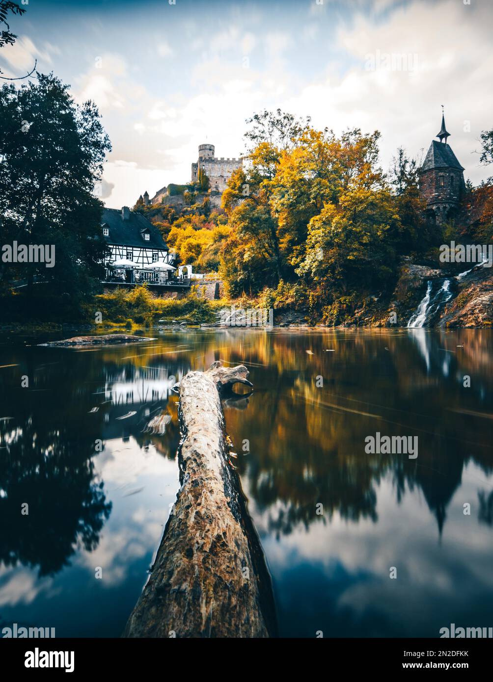 Pyrmonter mill at the waterfall of Elzbach with the castle Pyrmont in ...
