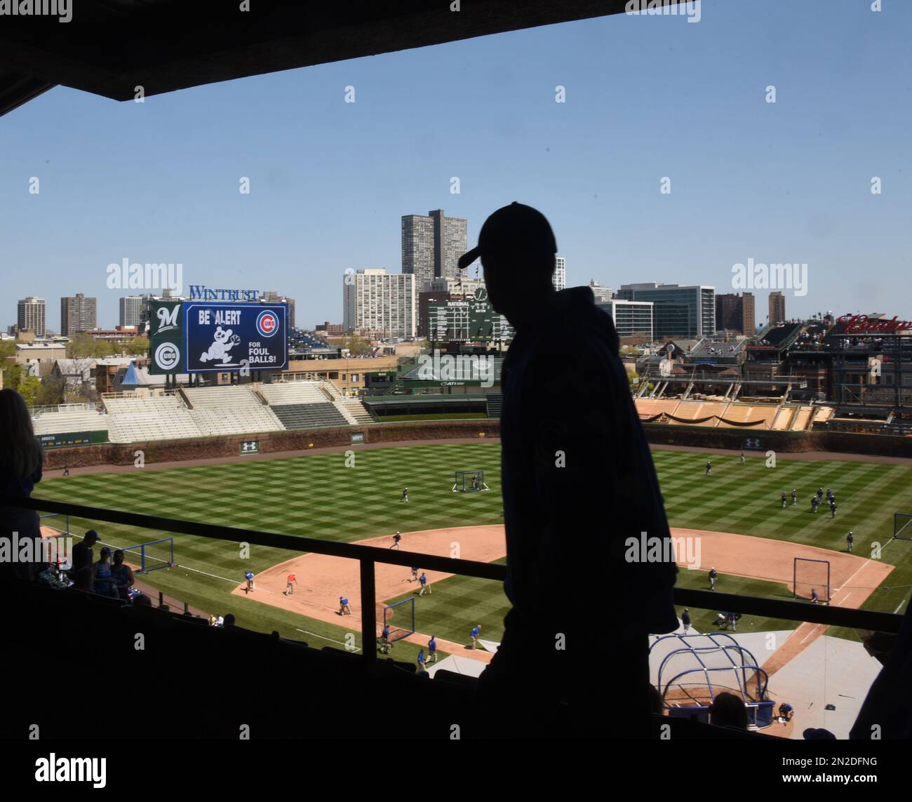 A baseball fan walks along the concourse before a baseball game between ...