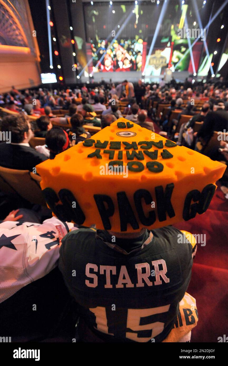 Green Bay Packers fan Steve Tate wears cheesehead as he watches the ...