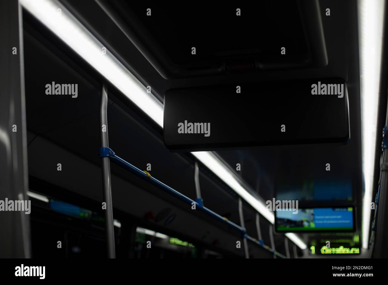Interior of bus. Night bus. Public transport details. Handrails inside ...