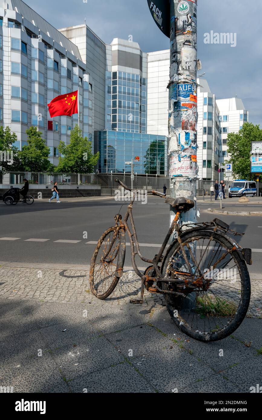 Rusty bicycle standing in front of the Chinese Embassy on Maerkisches ...