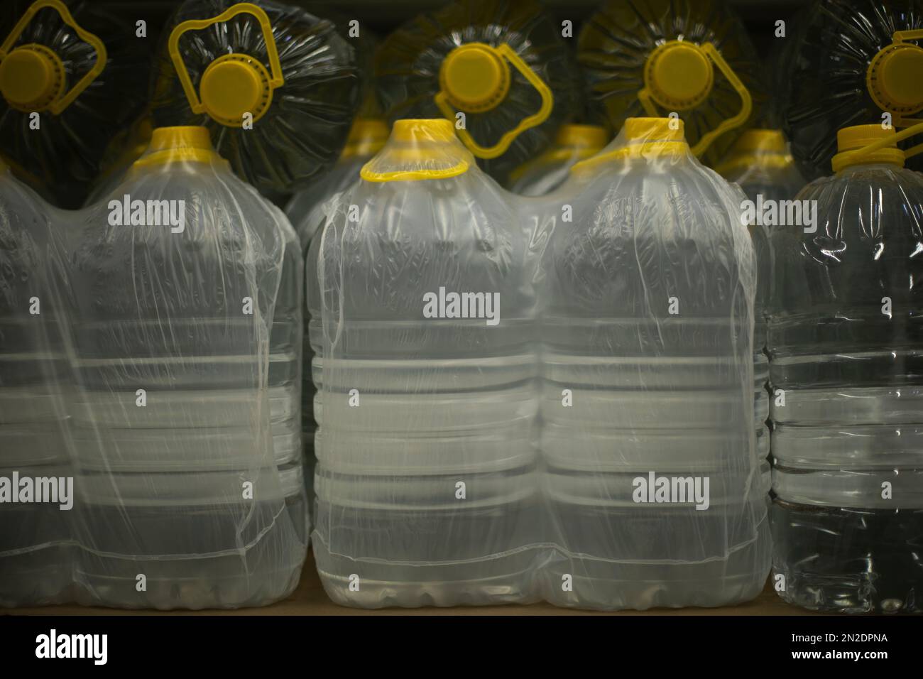 Water bottles. Water in store. Bottles in plastic packaging. Water in ...