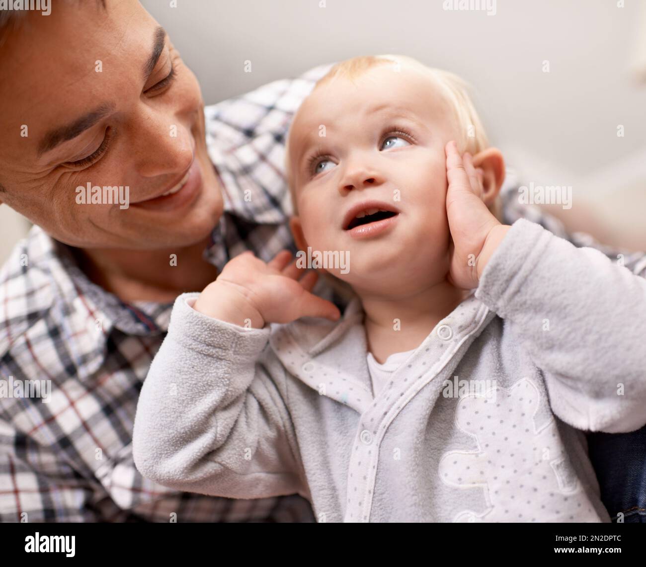 You are so adorable. A young father spending quality time his baby ...