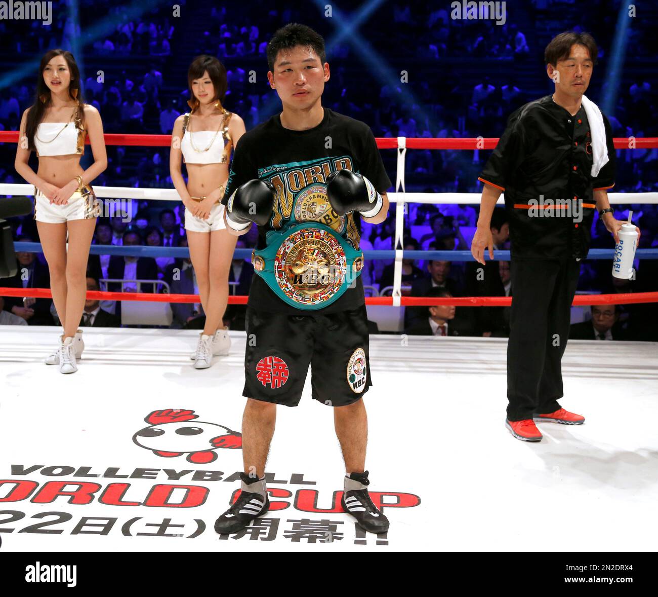 Japanese boxer Takashi Miura wearing his champion belt poses for a ...