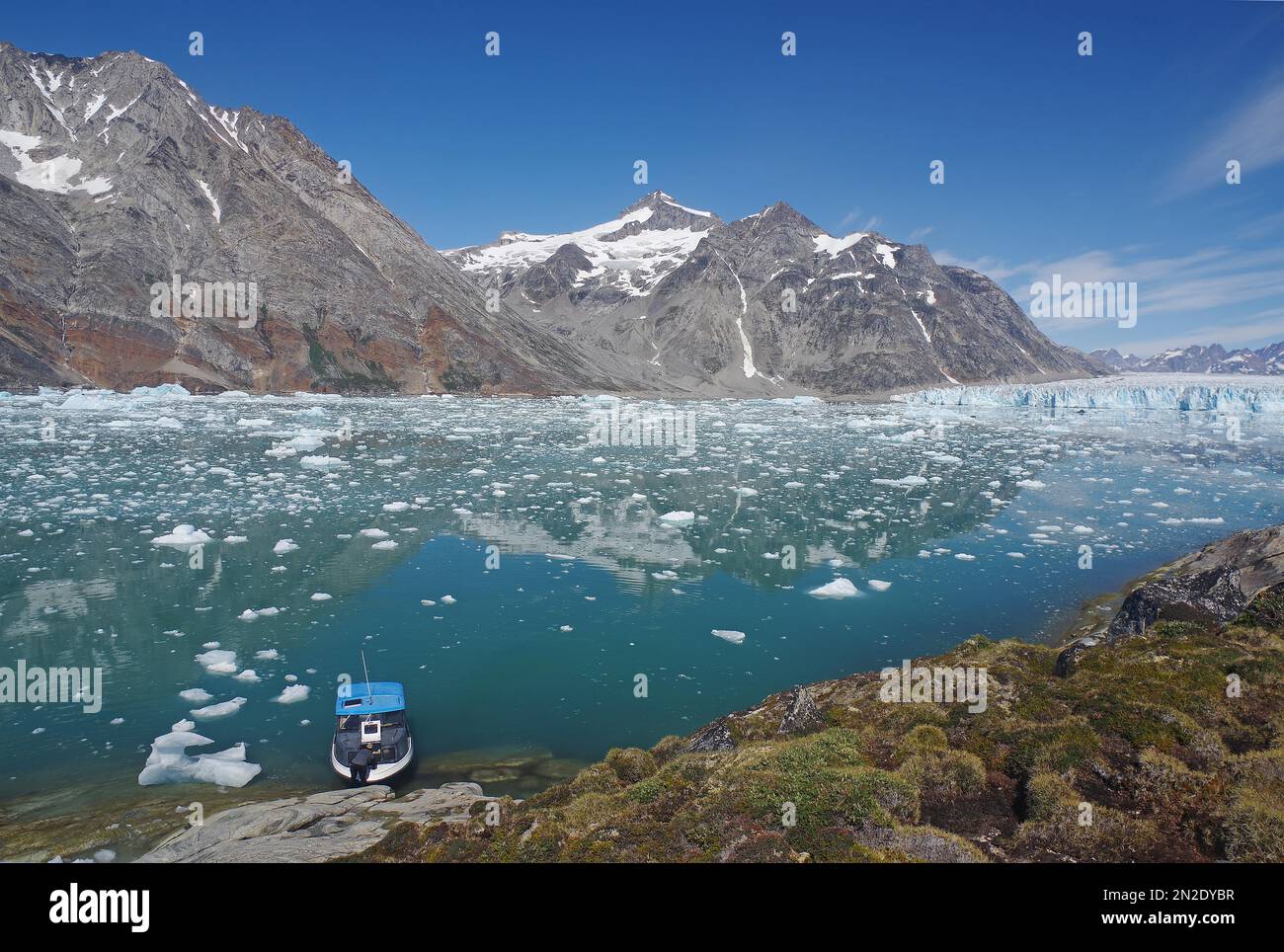 Small boat in a fjord with ice and icebergs, glacier, Arctic, Knud ...