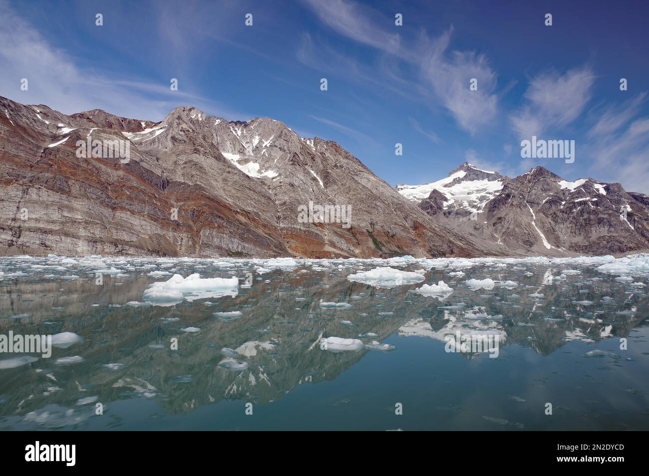 Fjord with drift ice, glacier and wild mountain landscape, summer, Knud ...