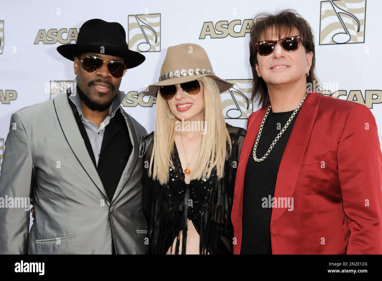 Michael Bearden, from left, Orianthi, and Richie Sambora arrive at the ...