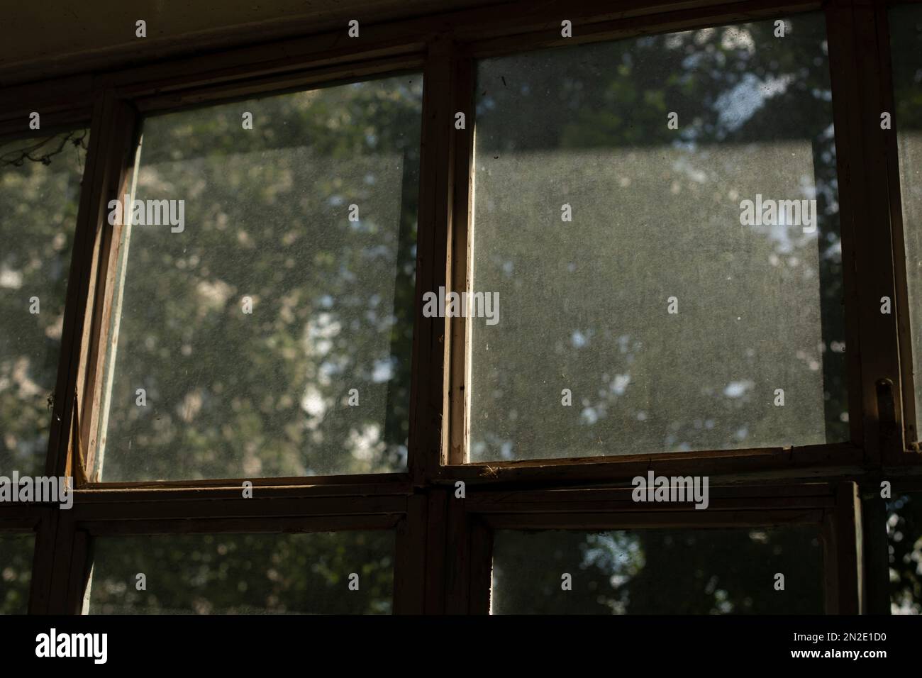 Old window frame. Glass on window. Interior details. Morning light on ...