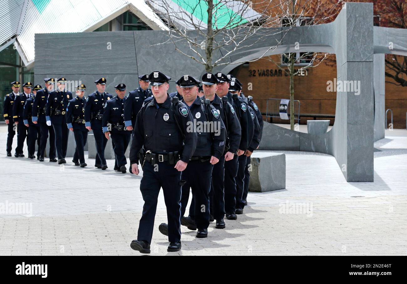 Massachusetts Institute of Technology campus police officers march past ...
