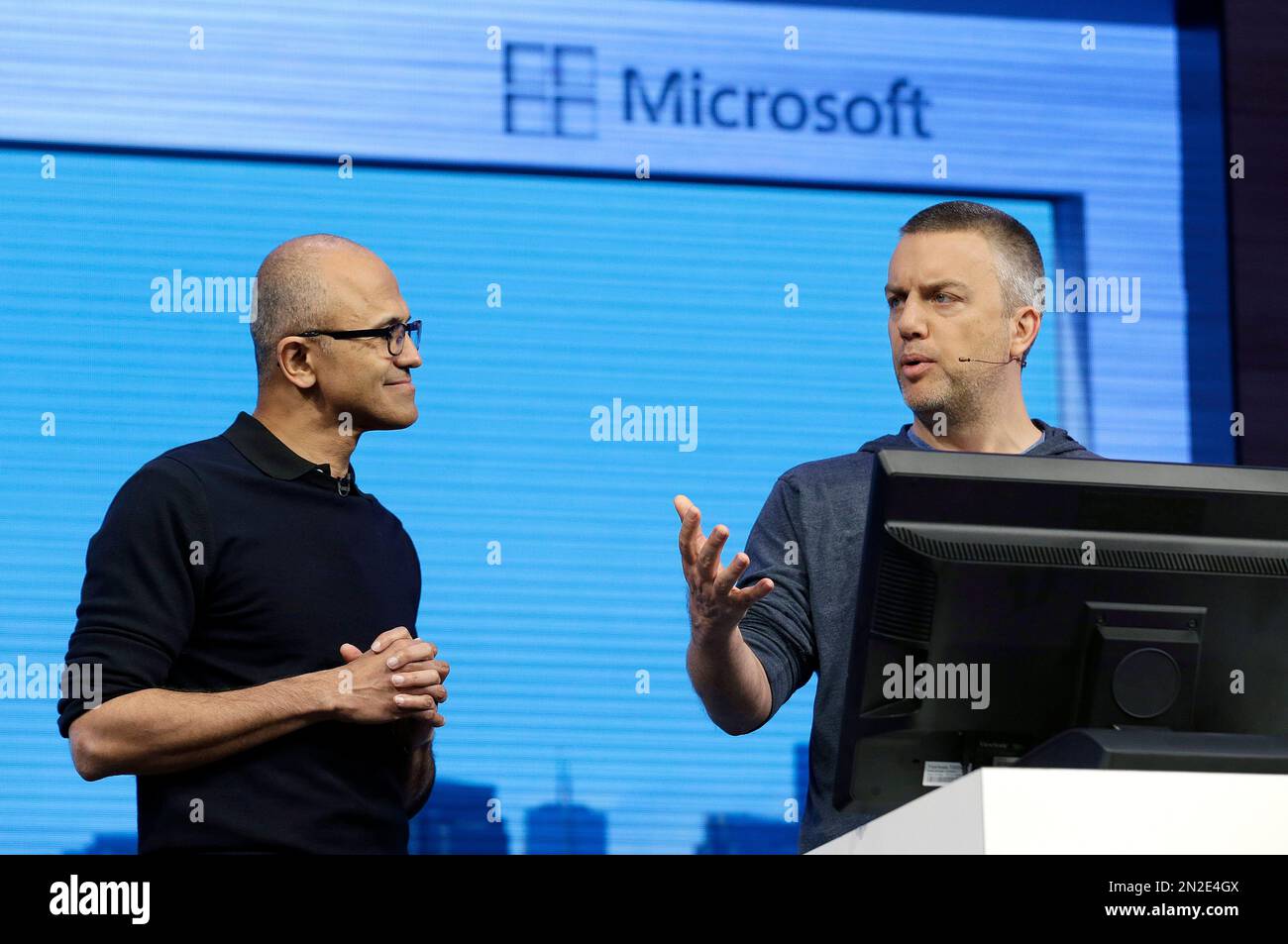 Microsoft CEO Satya Nadella, left, listens as Microsoft general manager of Office Extensibility ...