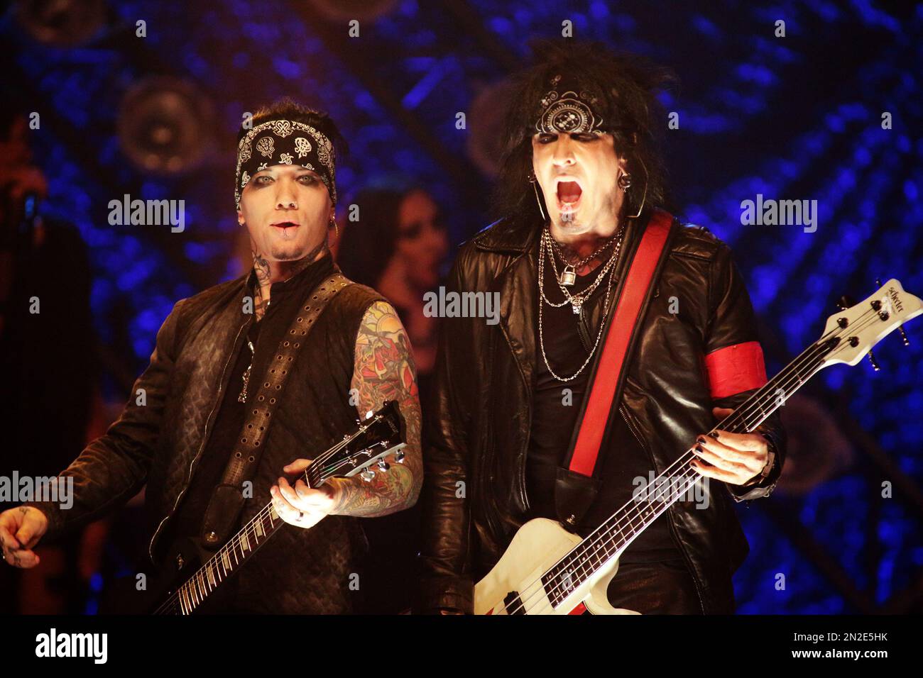 DJ Ashba, left, and Nikki Sixx of the band Sixx:A.M. perform in concert ...