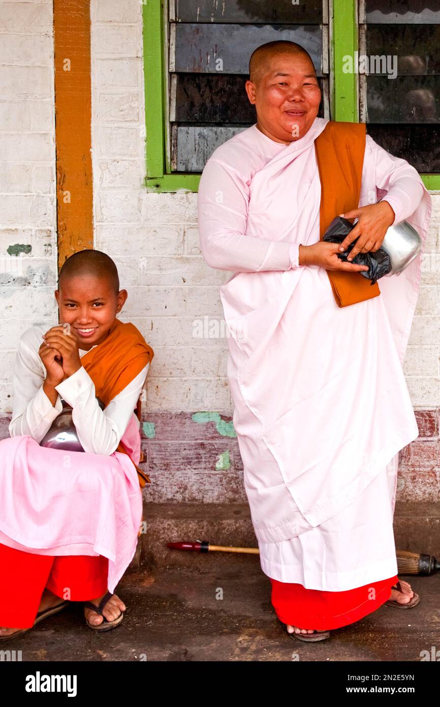 Female monks, Thiri Mingaleay vegetable market, Yangoon, Myanmar ...
