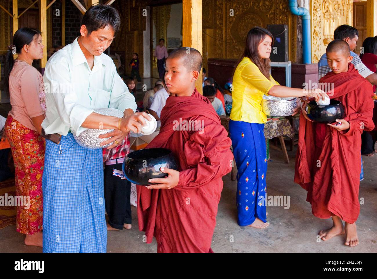 Rice feeding at the inauguration ceremony of A Lo Taw Pauk Pagoda, Inle ...
