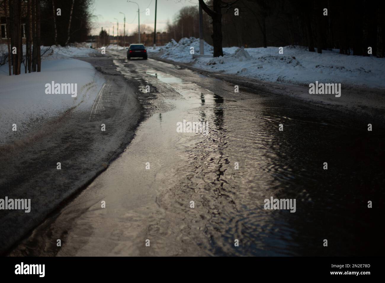 Wet road. Puddle on pavement. Water on highway. Car left on road Stock ...