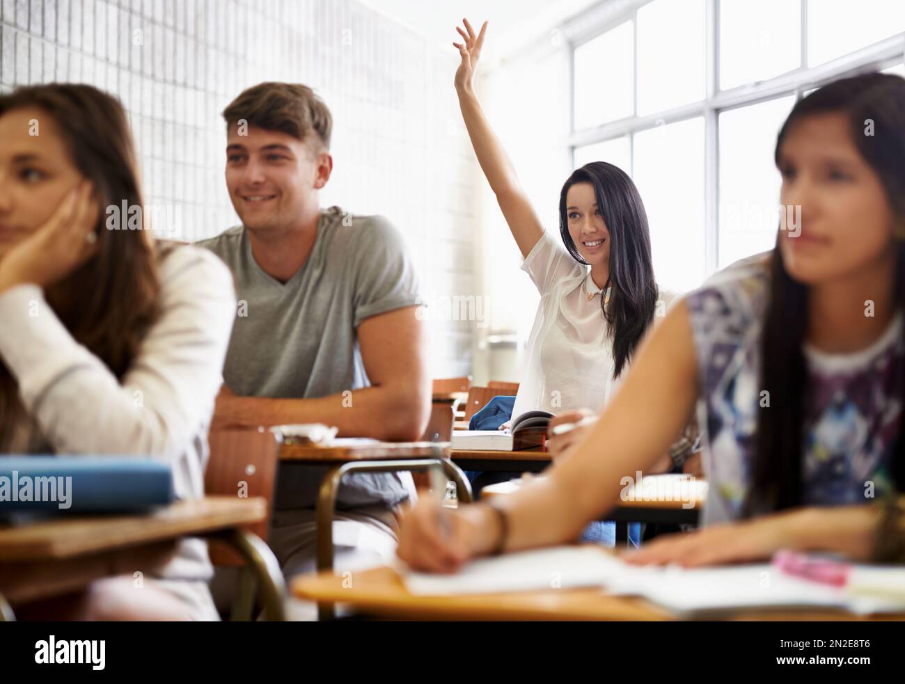 Working her way towards a distinction. A young woman raising her hand ...