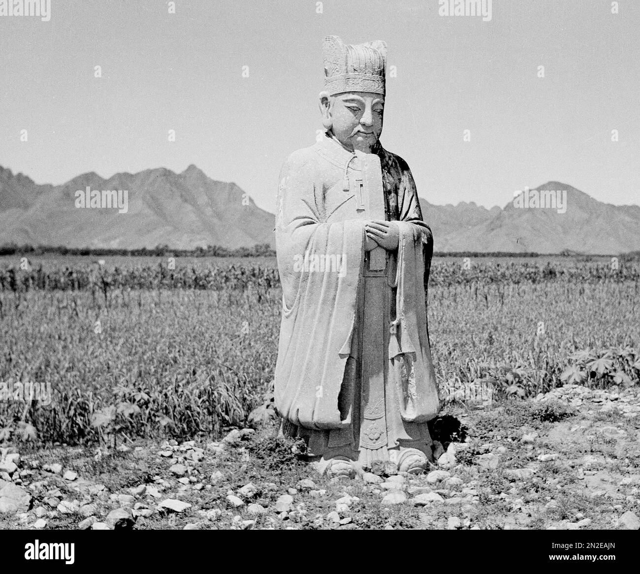 Stone figure of a god, one of many statues of guardian animals and gods ...