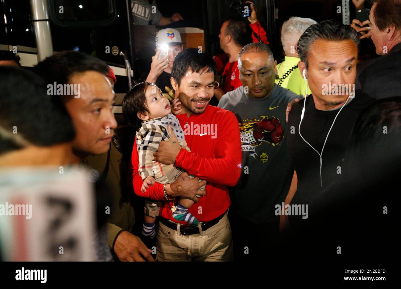 ADDS ID OF CHILD - Boxer Manny Pacquiao, of the Philippines, holds his ...