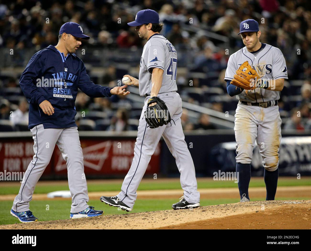 Tampa Bay Rays pitcher Brandon Gomes (47) hands the ball off to manager ...