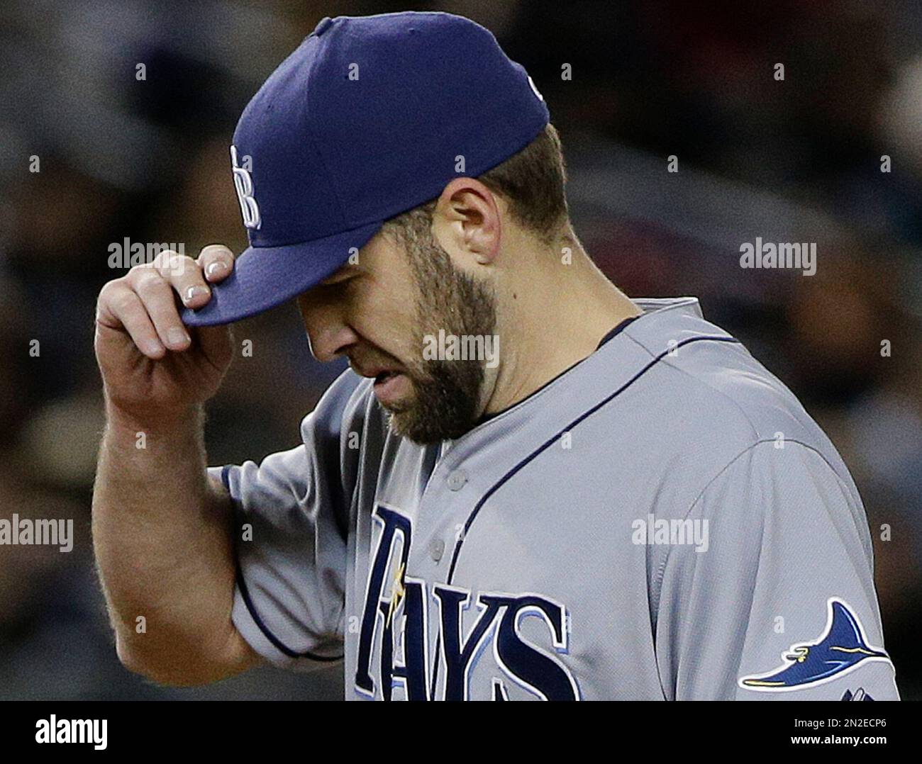 Tampa Bay Rays pitcher Nathan Karns (51) reacts after walking New York ...