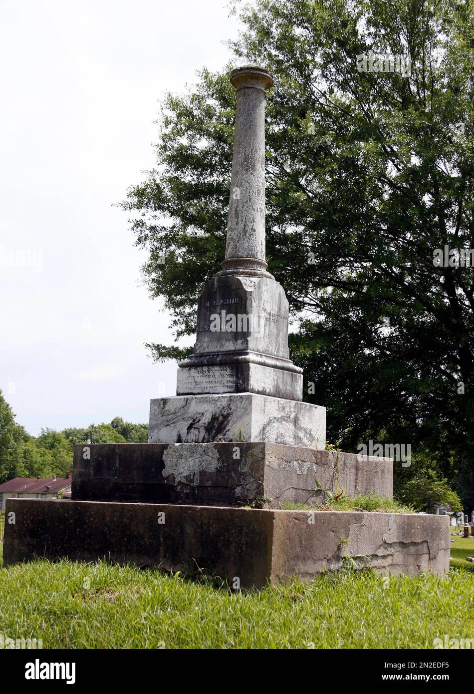 A weathered memorial marks the entrance to the Confederate burial plot ...