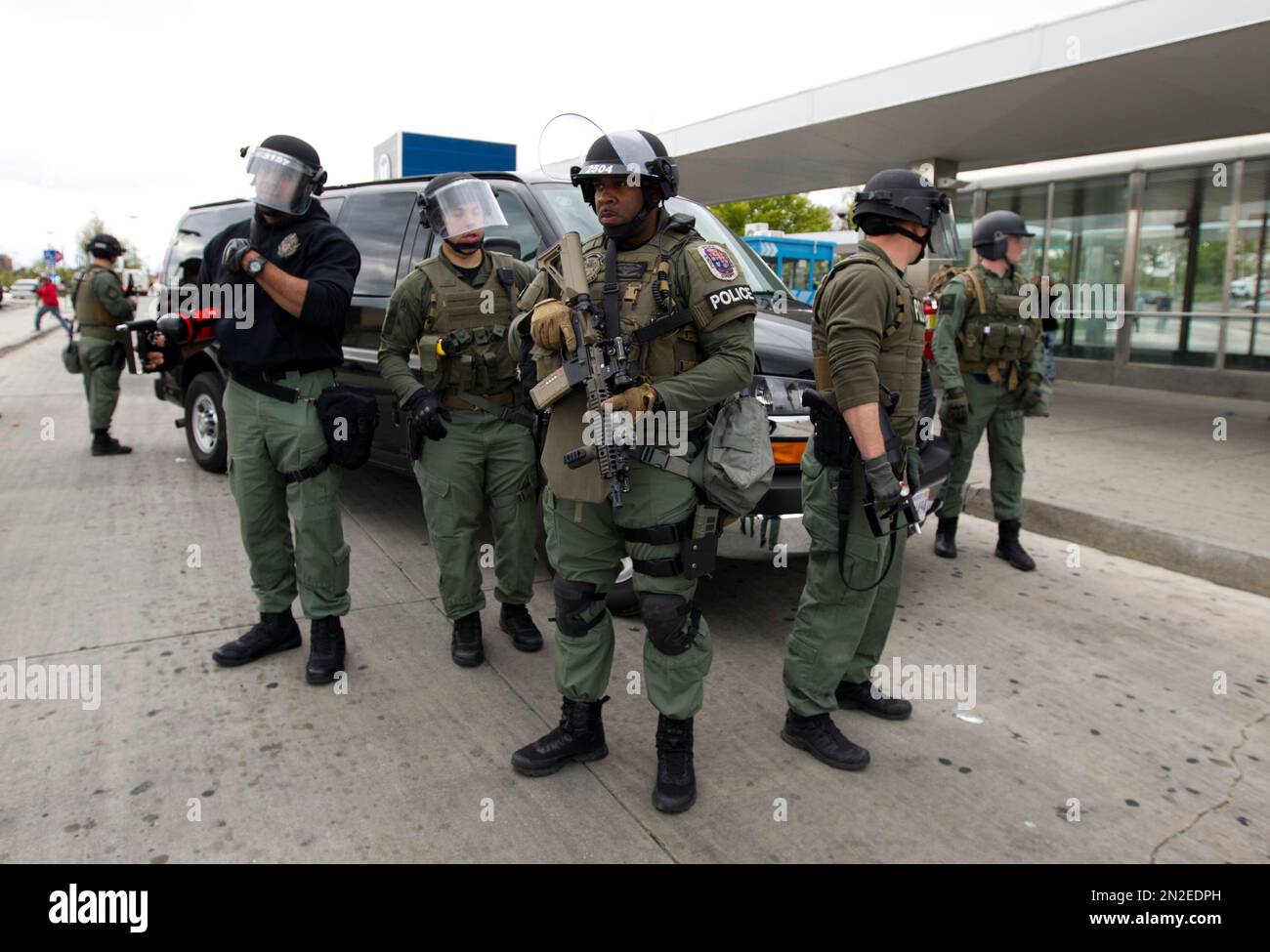Baltimore police officers respond to demonstrators who were throwing ...